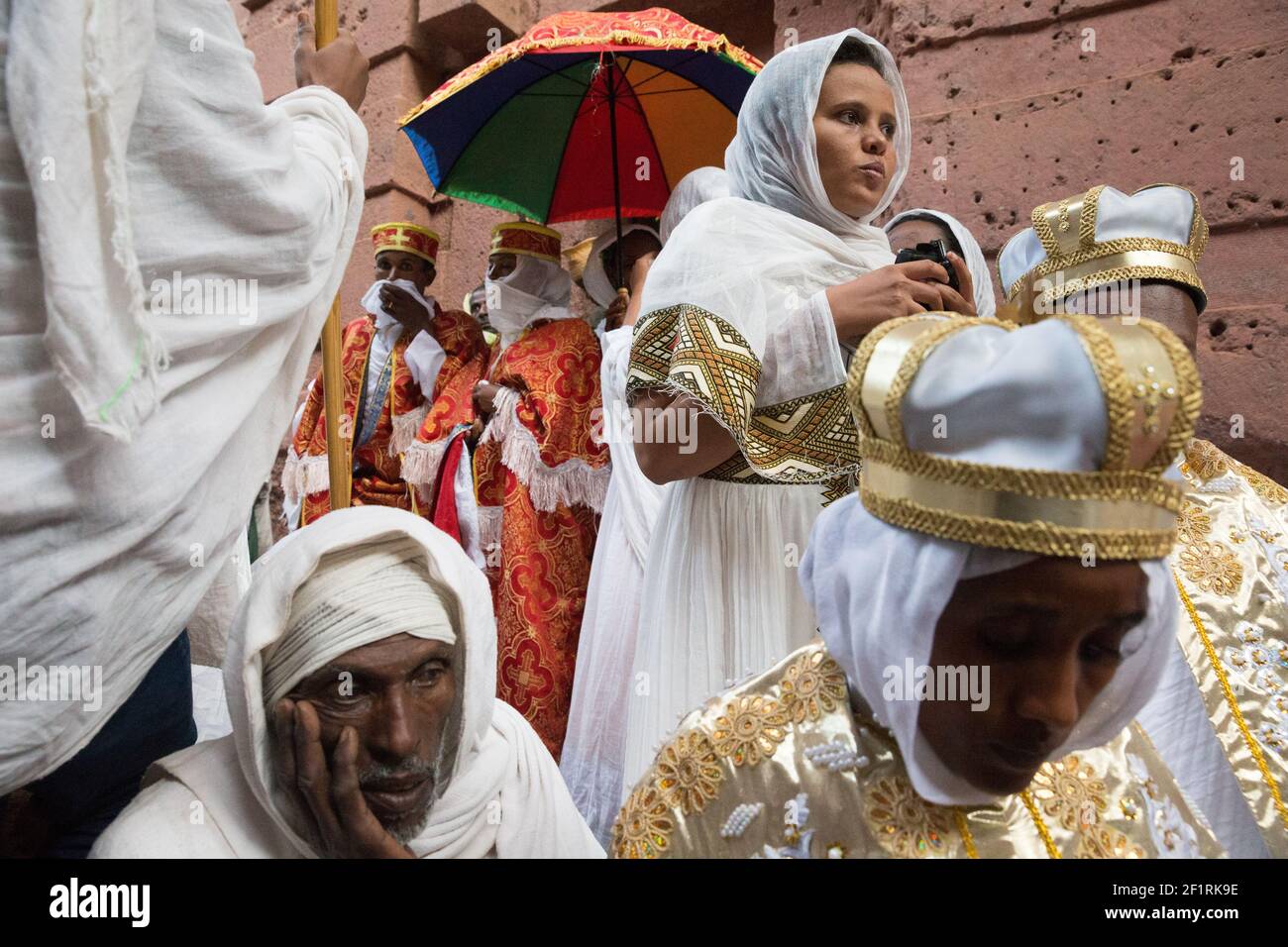 Pilgrims watch the crowds below at St. Emmanuel Church during Gena, the ...