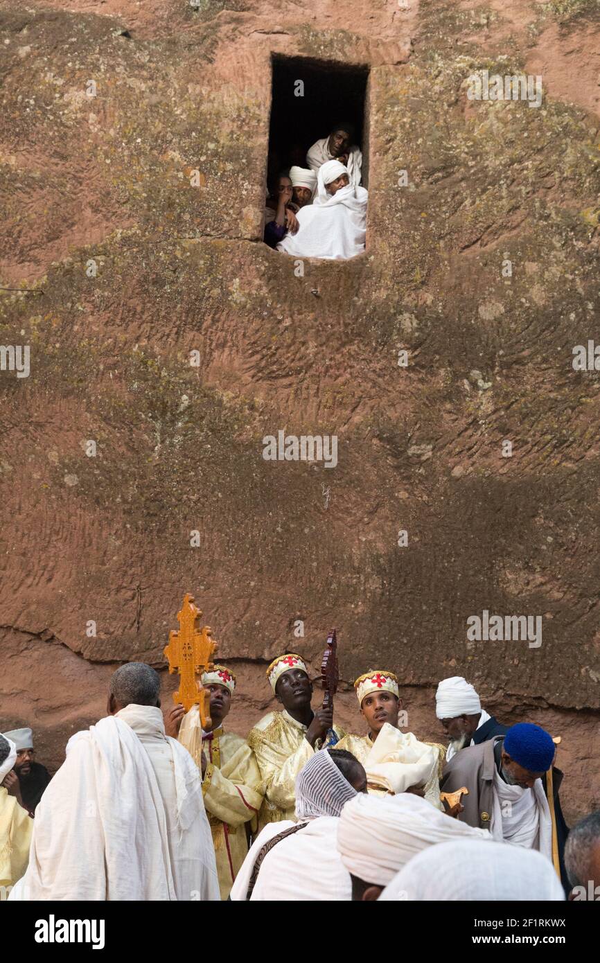 Pilgrims watch the crowds below at St. Emmanuel Church during Gena, the ...