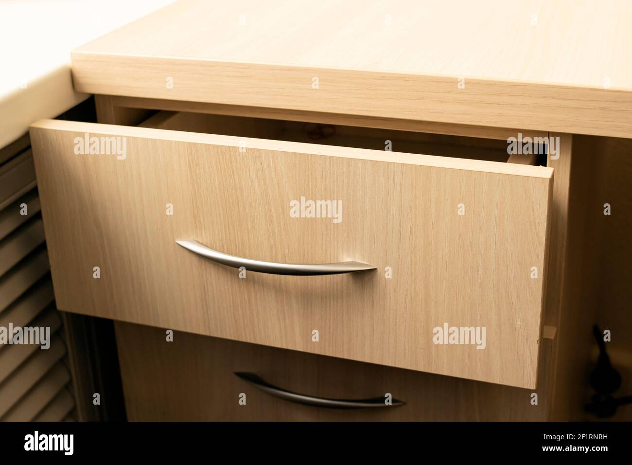 Open drawer of a wooden table lose up Stock Photo - Alamy