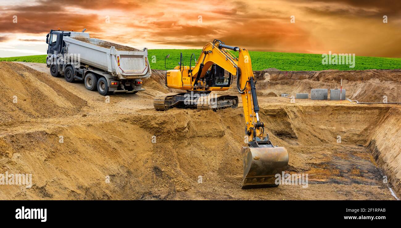 excavator at work on construction site Stock Photo - Alamy