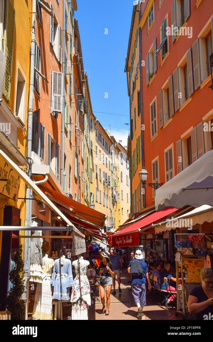 People visiting shops in Old Town Nice, South of France, in summer ...