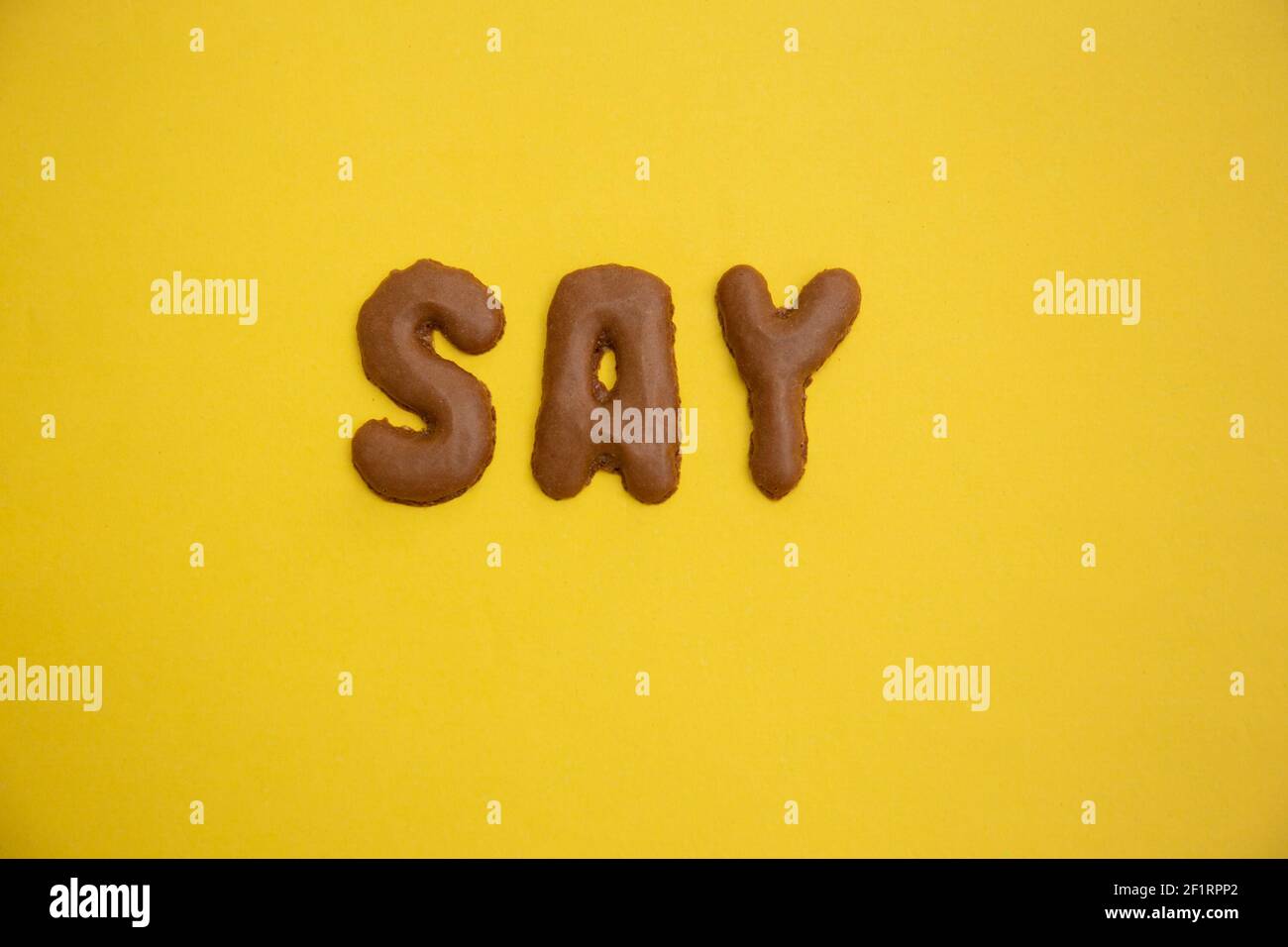 The word SAY arranged with homemade chocolate cookie alphabet on a ...