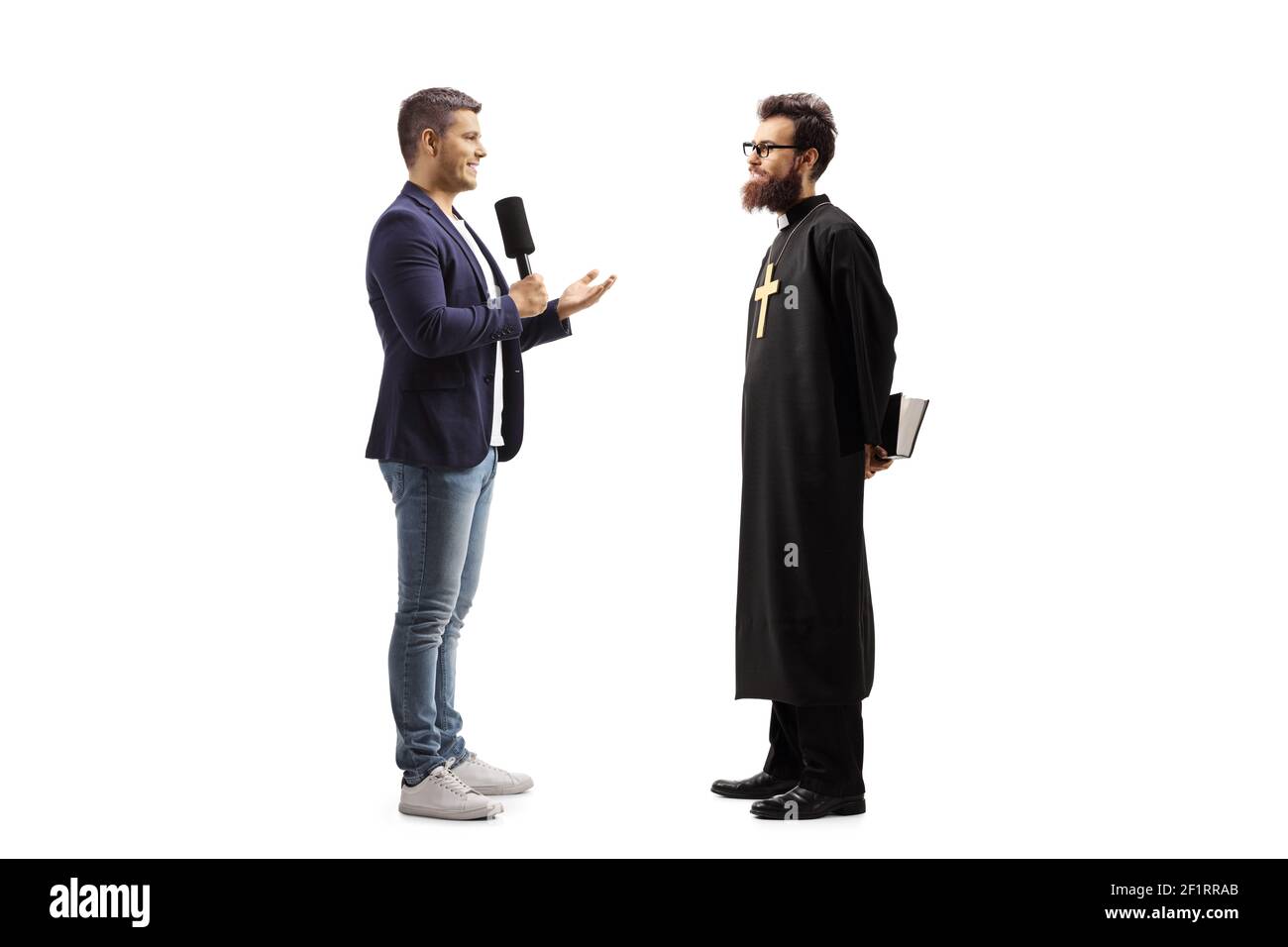 Full length profile shot of a reporter with a microphone talking to a ...