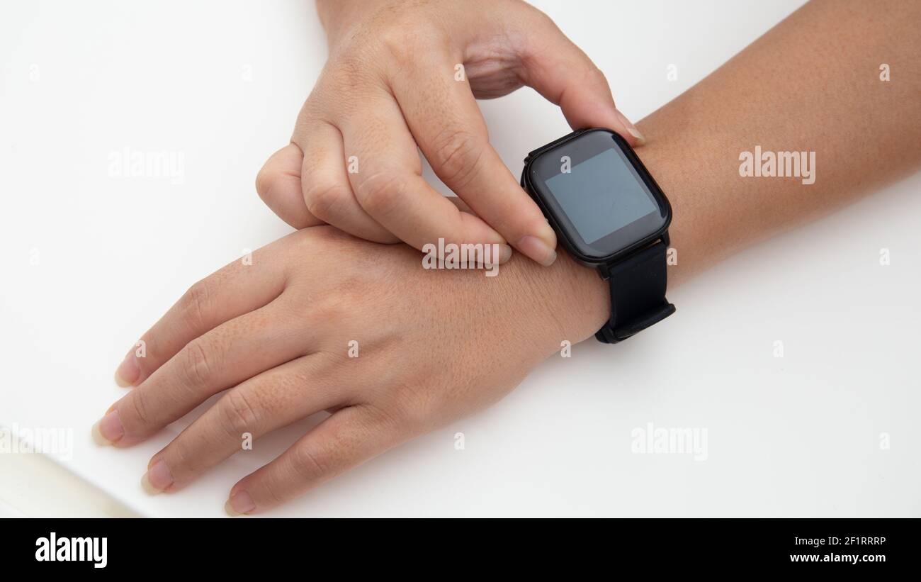 A female's hand using asmartwatch for checking notifications Stock ...
