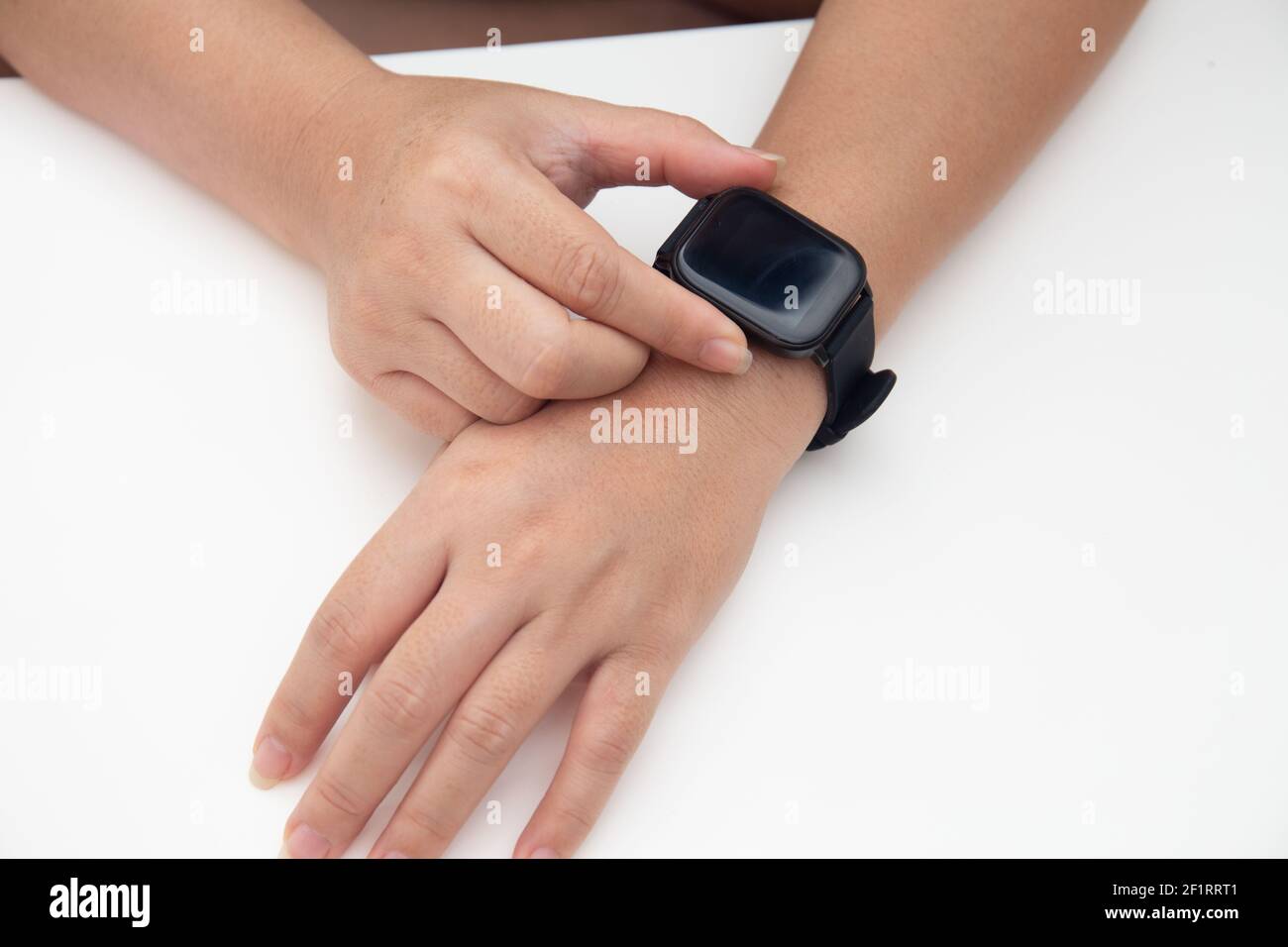 A female's hand using a smartwatch for checking notifications Stock ...