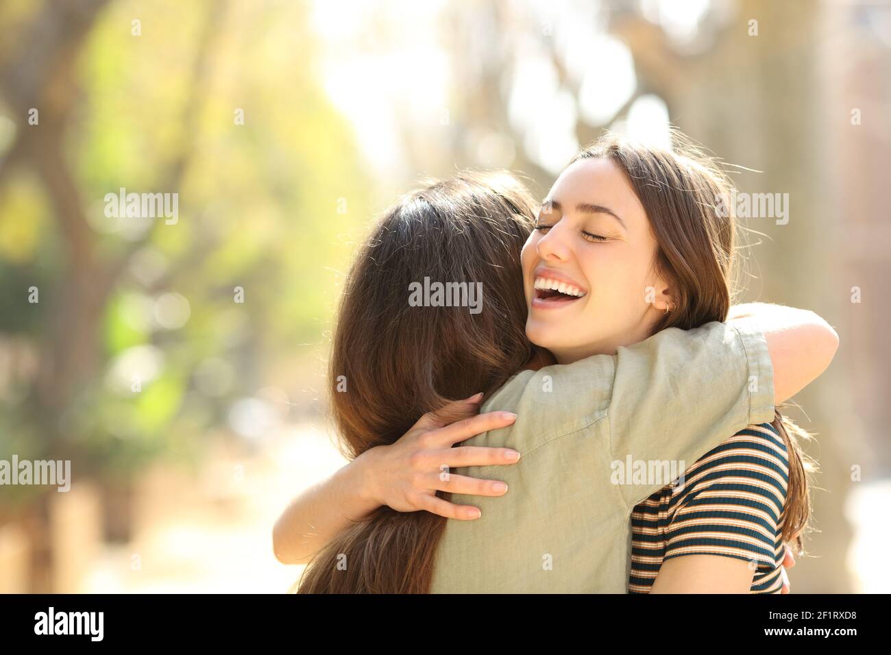 Two women laughing in park hi-res stock photography and images - Alamy