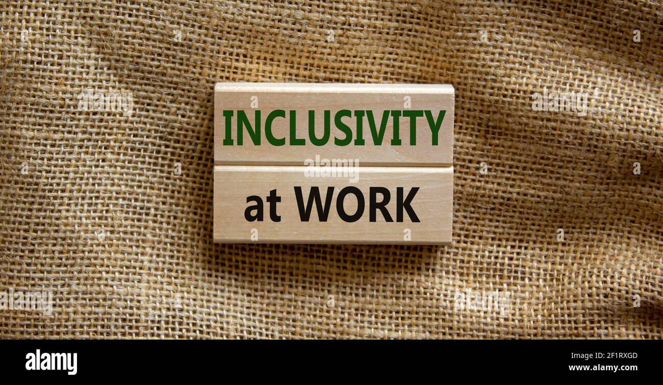 Inclusivity at work symbol. Wooden blocks with words 'Inclusivity at ...