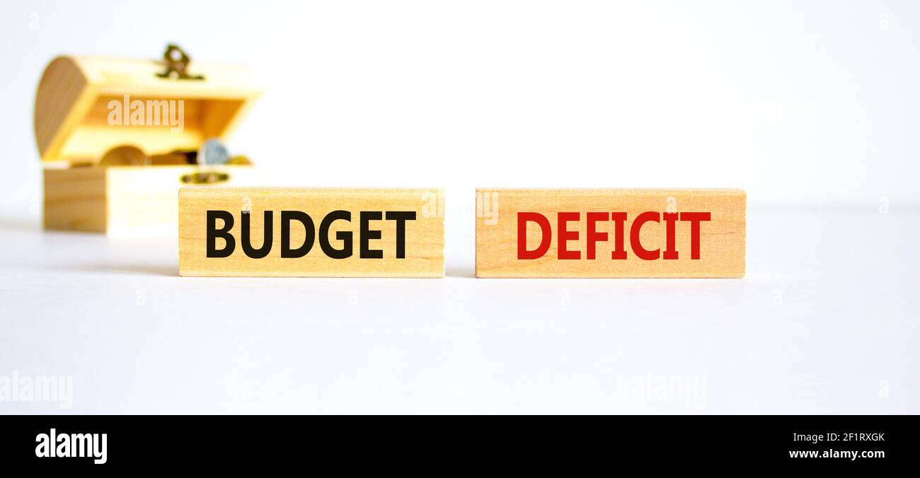 Budget deficit symbol. Concept words 'budget deficit' on wooden blocks ...