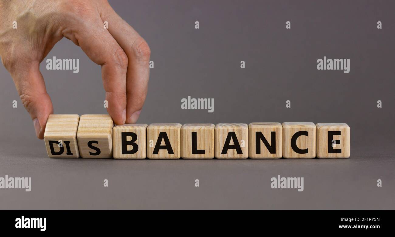 Balance or disbalance symbol. Businessman turns cubes and changes the ...