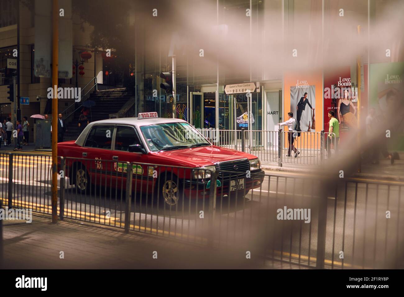 Red taxi in the centre of Hong Kong Stock Photo - Alamy