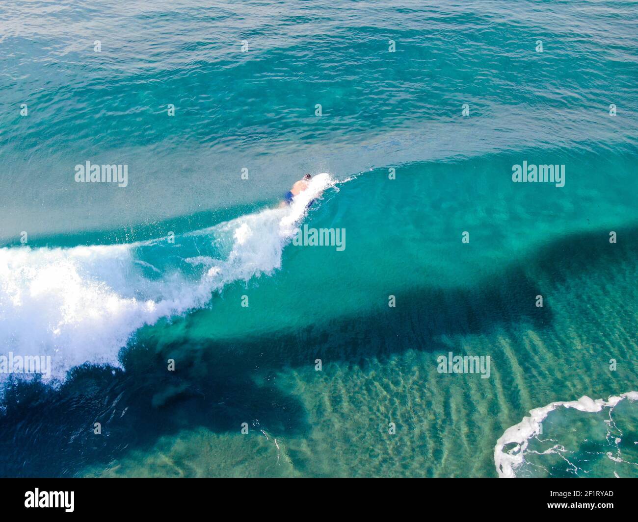 Aerial view surfers enjoying waves hi-res stock photography and images ...