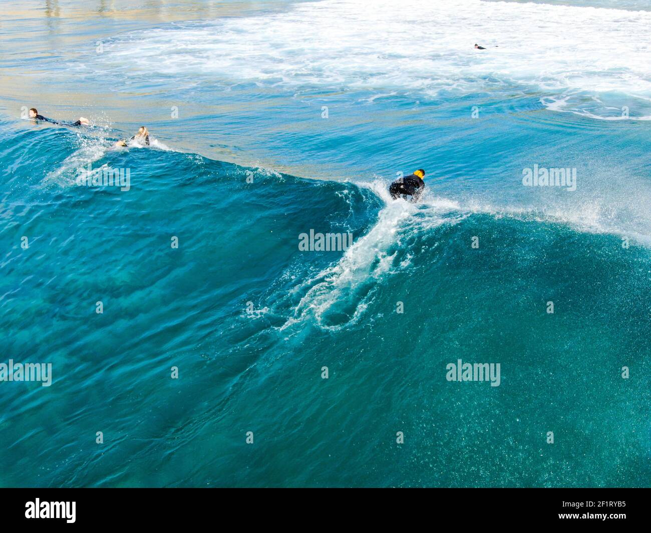 Aerial view surfers enjoying waves hi-res stock photography and images ...