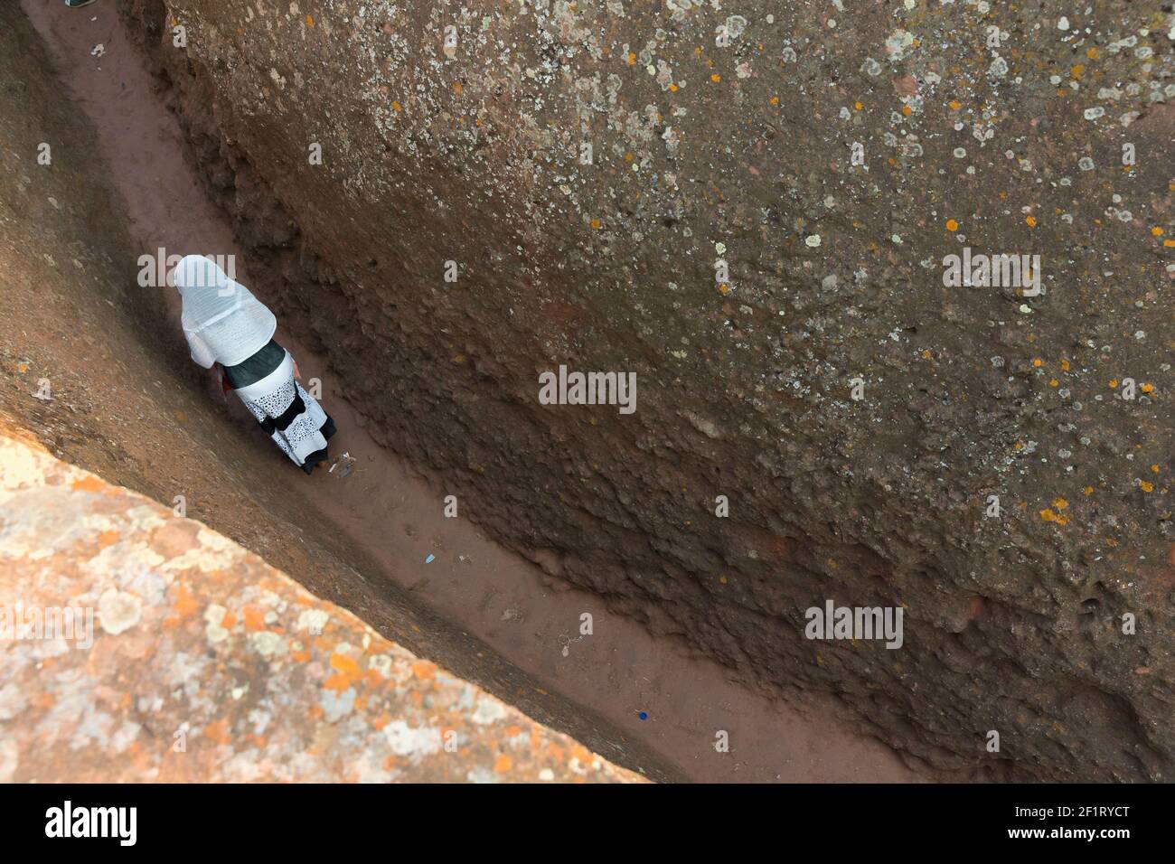 Pilgrim walkthrough a narrow passageway to visit The Church of Saint ...
