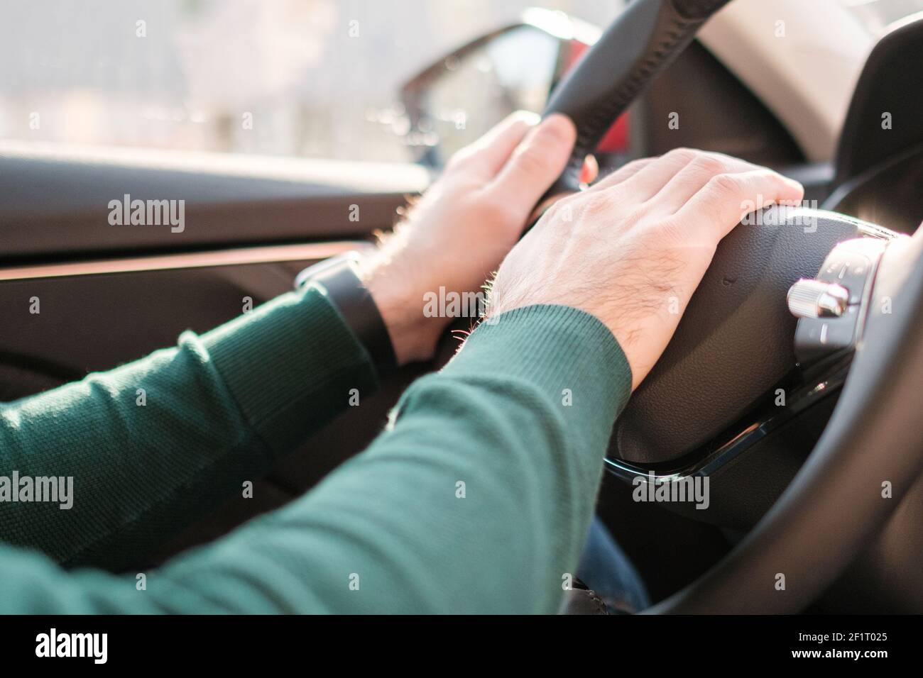 Close up mans hands on the wheel, driving a car Stock Photo - Alamy