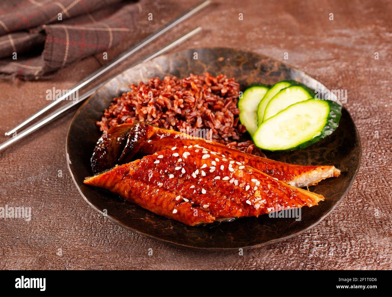 Fried unagi eel with sauce sesame and rice close-up Stock Photo - Alamy