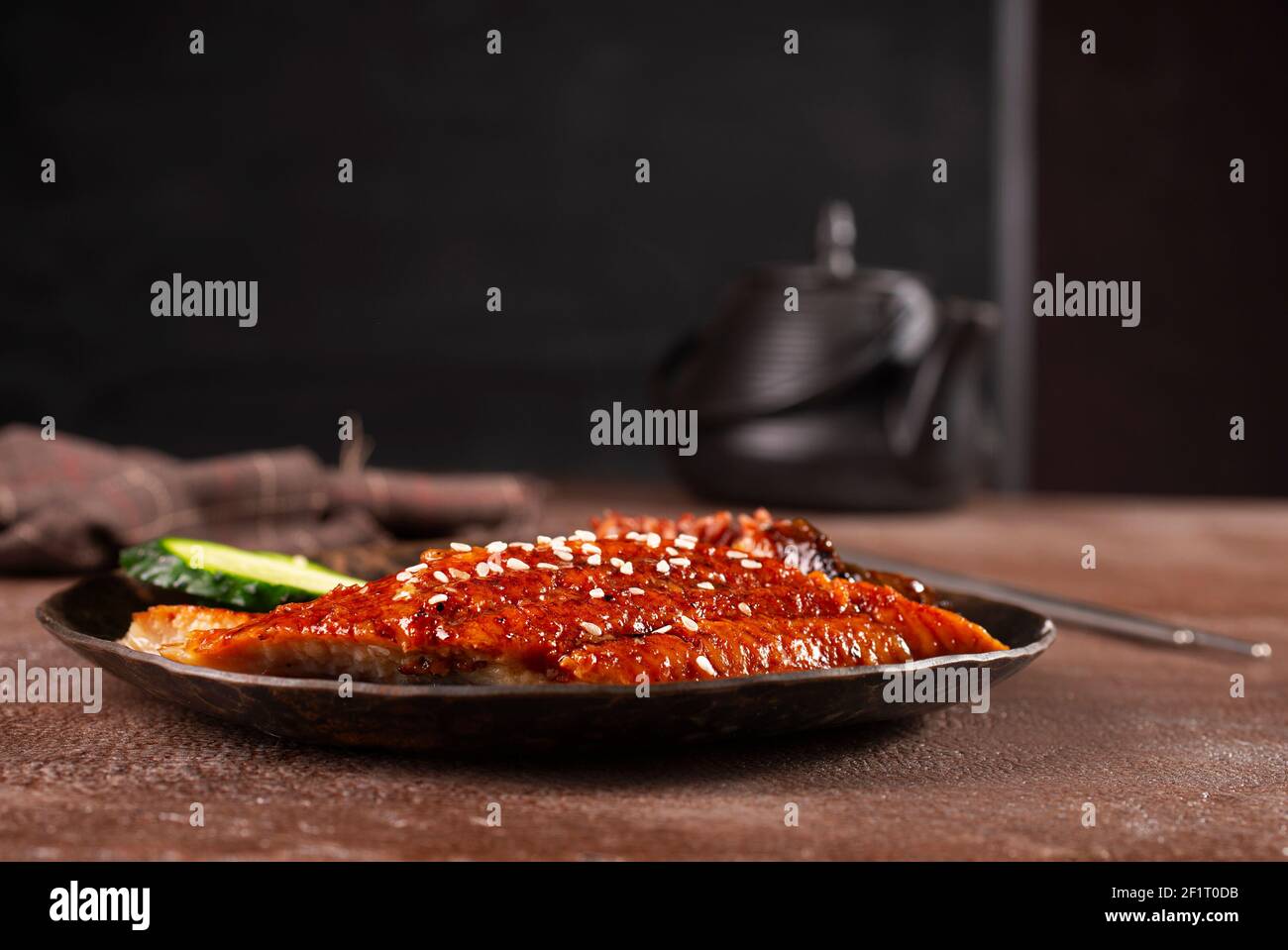 Fried unagi eel with sauce sesame and rice close-up Stock Photo - Alamy