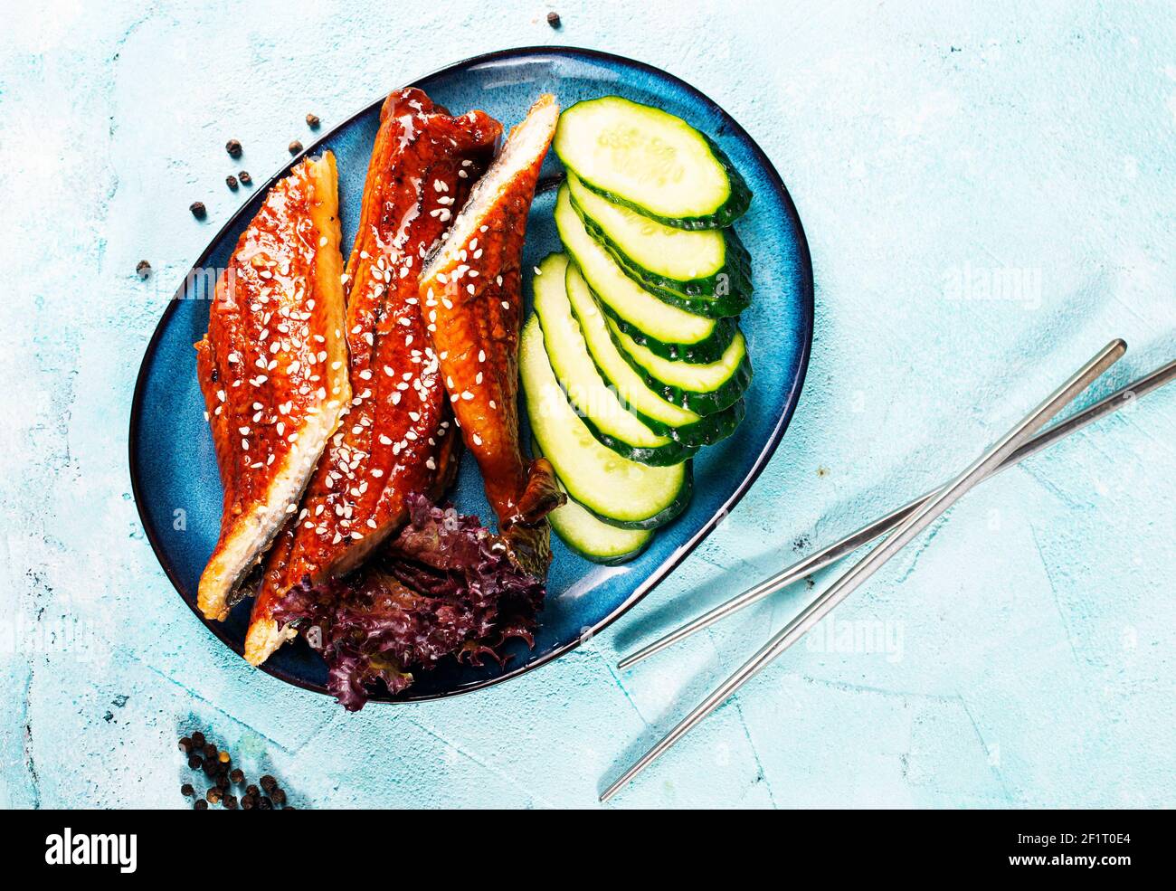 Fried unagi eel with sauce sesame and rice close-up Stock Photo - Alamy