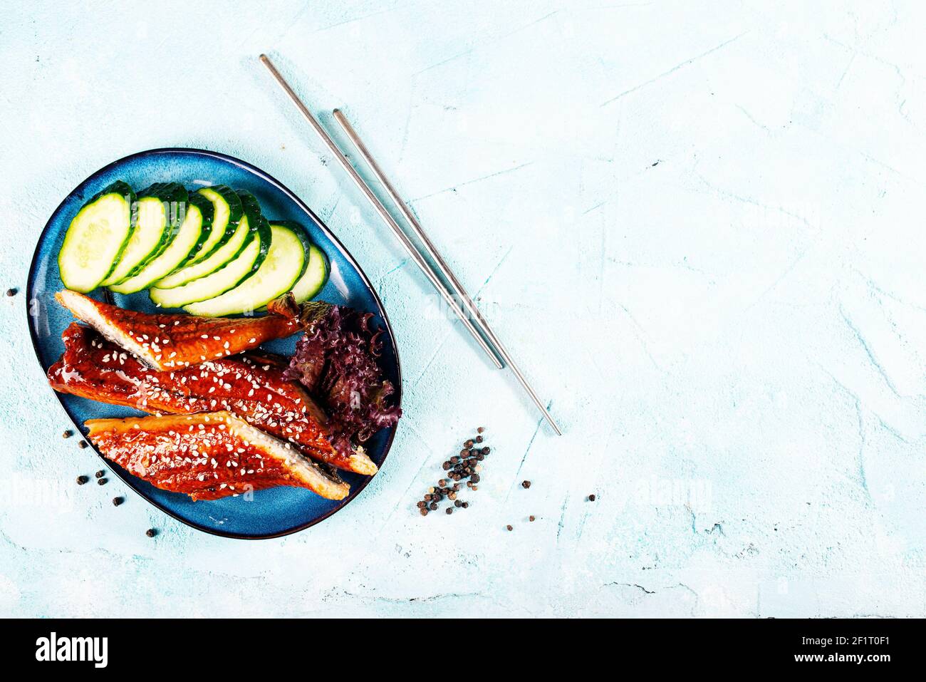 Fried unagi eel with sauce sesame and rice close-up Stock Photo - Alamy