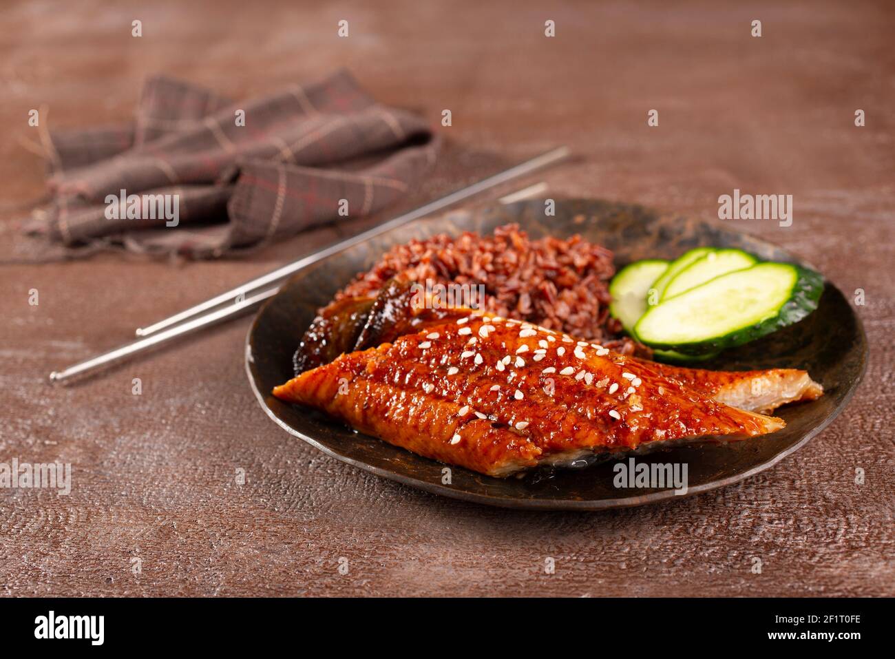 Fried unagi eel with sauce sesame and rice close-up Stock Photo - Alamy