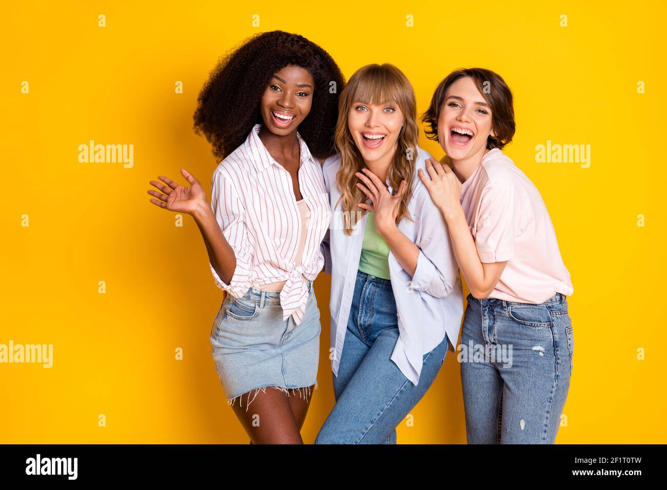 Portrait of three pretty cheerful persons diversity laughing look ...