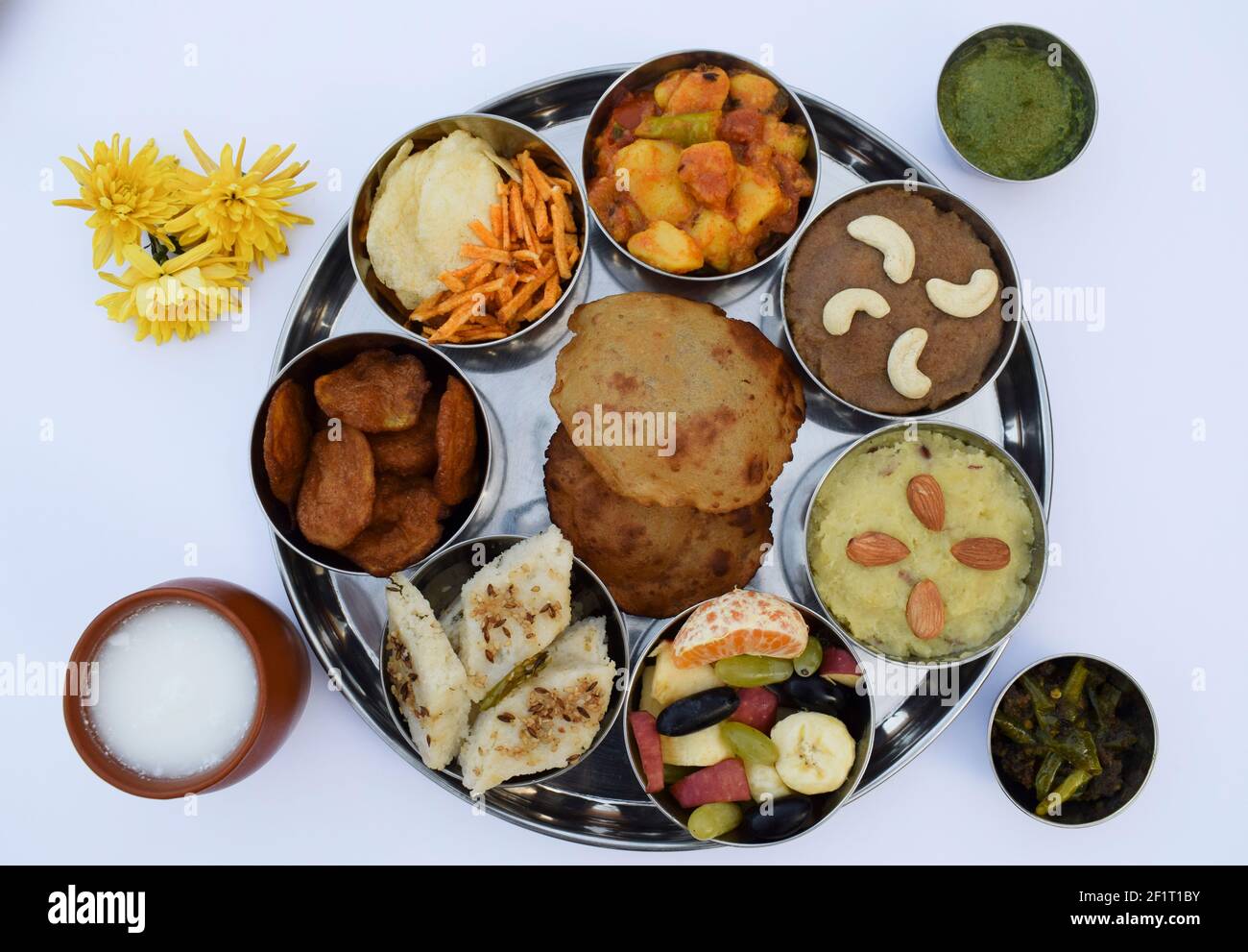 Farali vrat thaali homemade items Rajgira sheera, paratha, puri bhajiya ...
