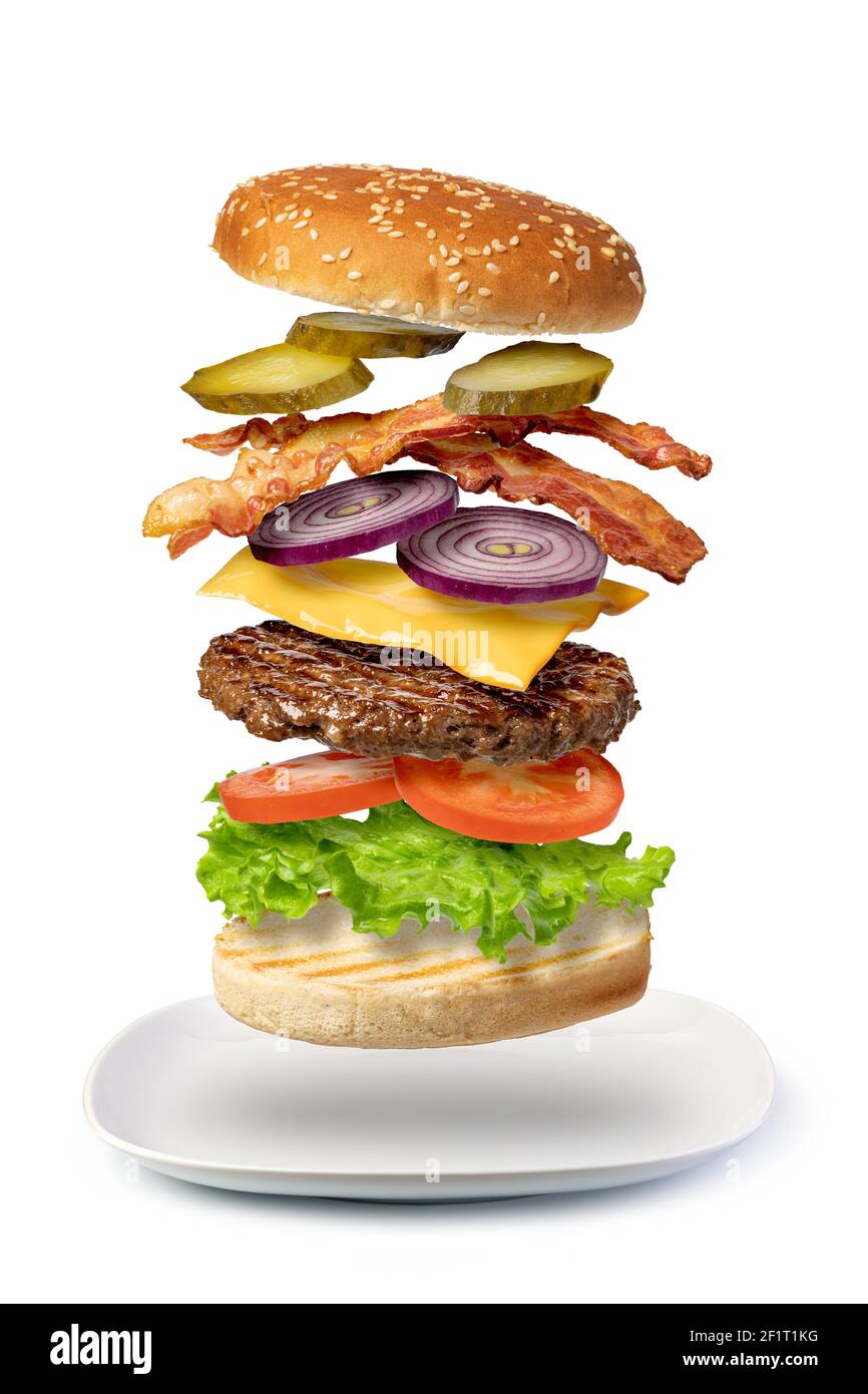Flying burger on a white background Stock Photo - Alamy