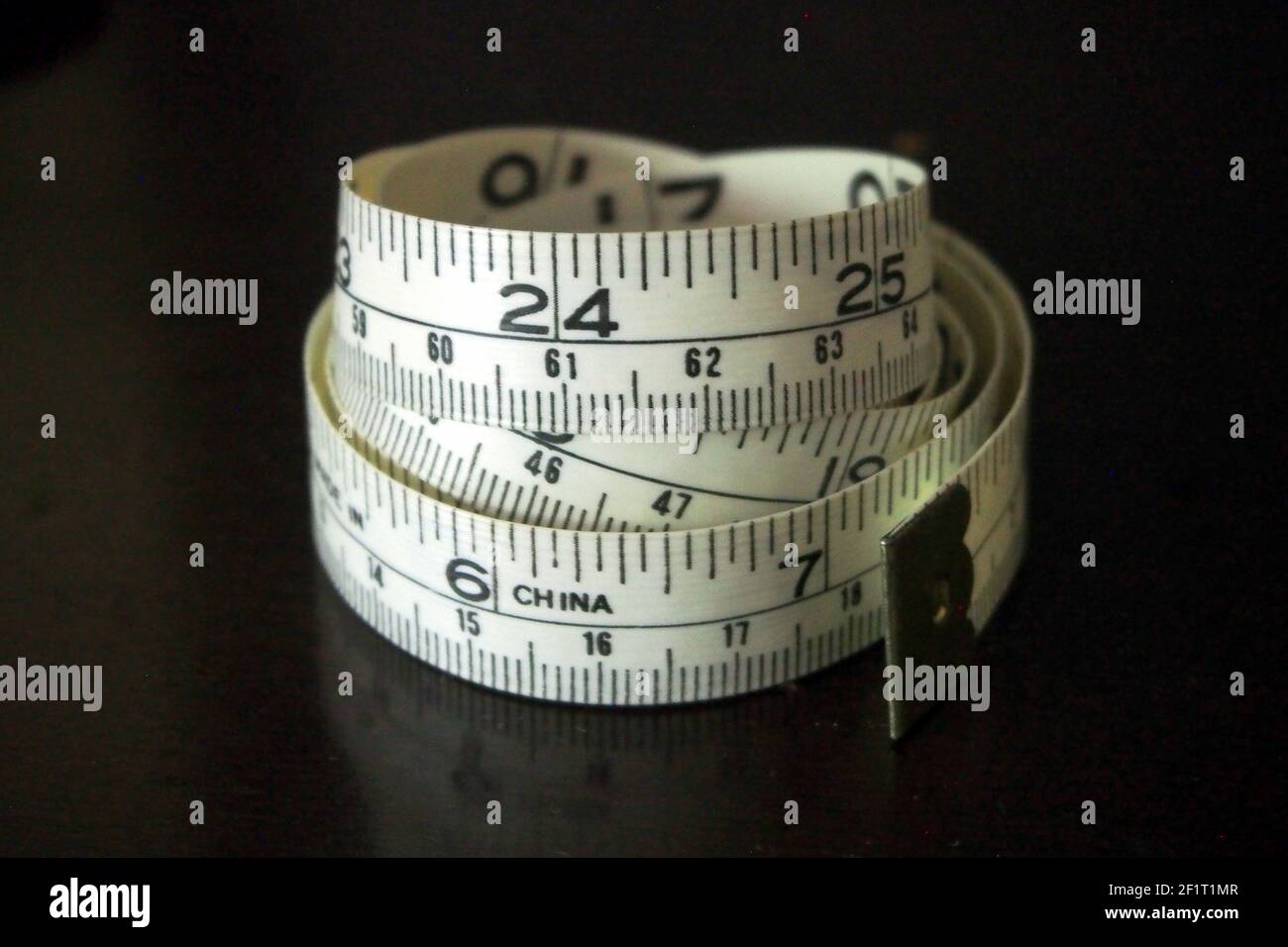 Rolled measuring tape hi-res stock photography and images - Alamy