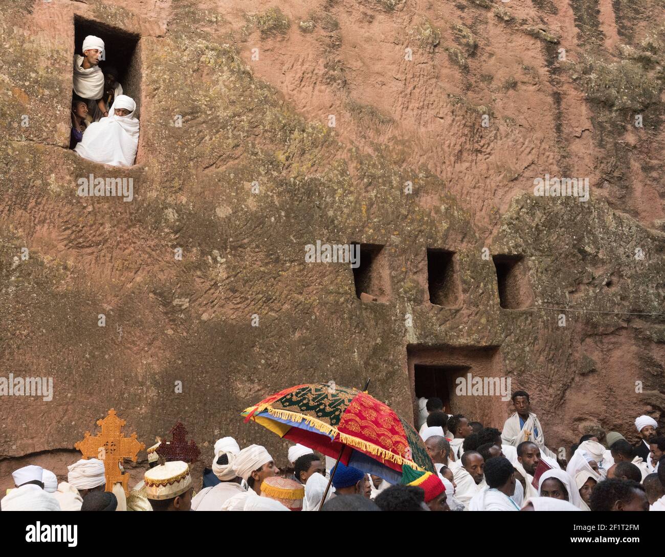 Pilgrims watch the crowds below at St. Emmanuel Church during Gena, the ...