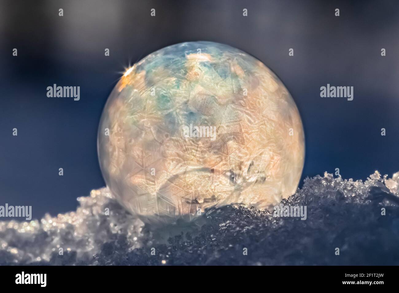 Bubbles, created in winter by the photographer, rapidly form ice ...