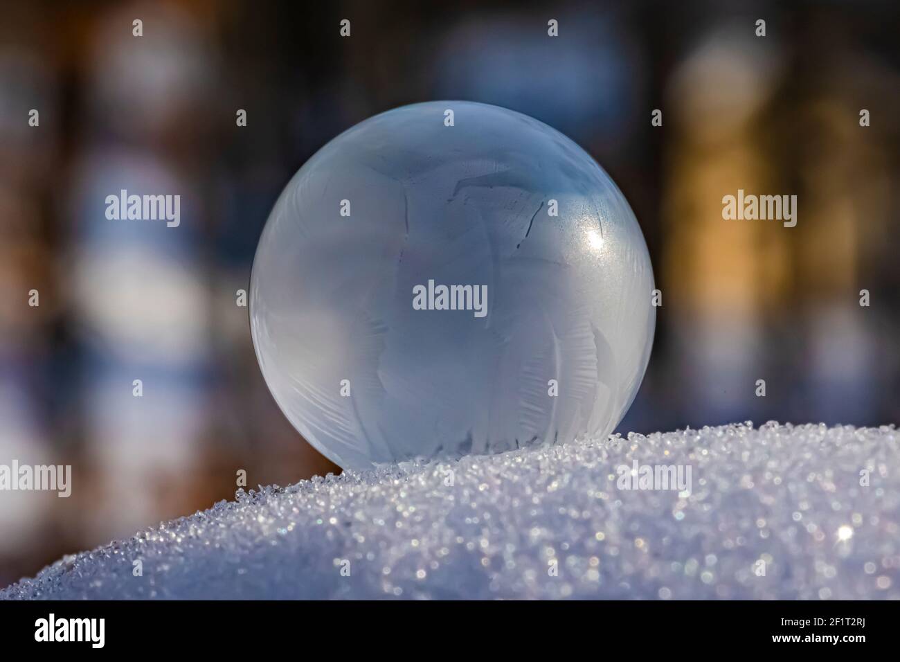 Bubbles, created in winter by the photographer, rapidly form ice ...