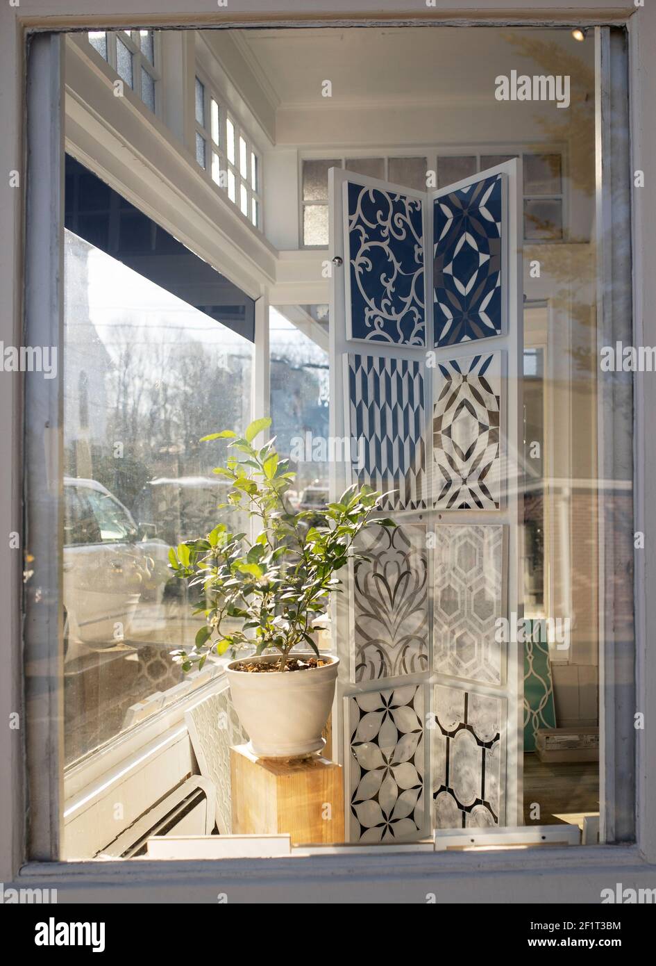 Light streams into a display window of an upscale ceramic tile shop on ...