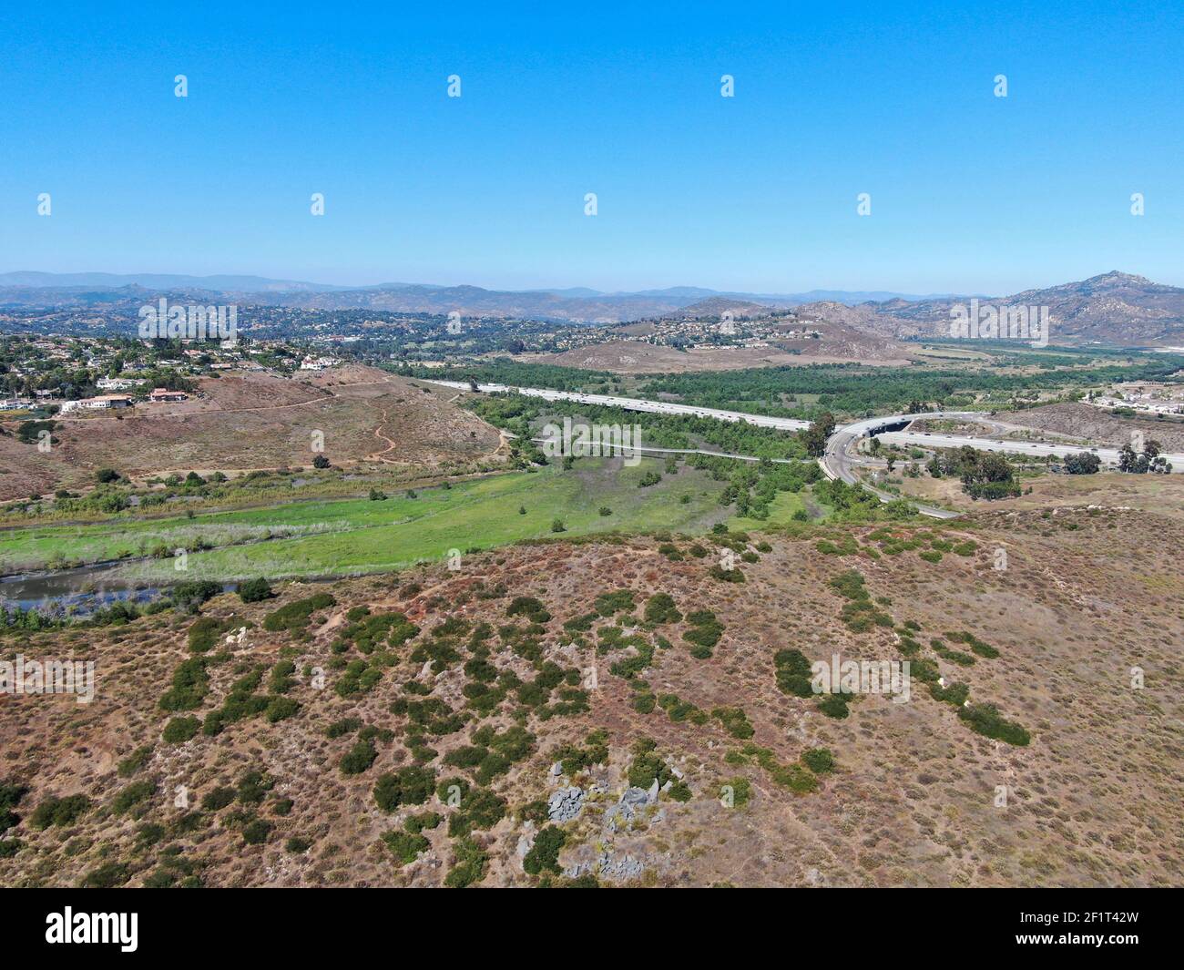 Aerial view of Rancho Bernardo mountain with freeway road on the ...