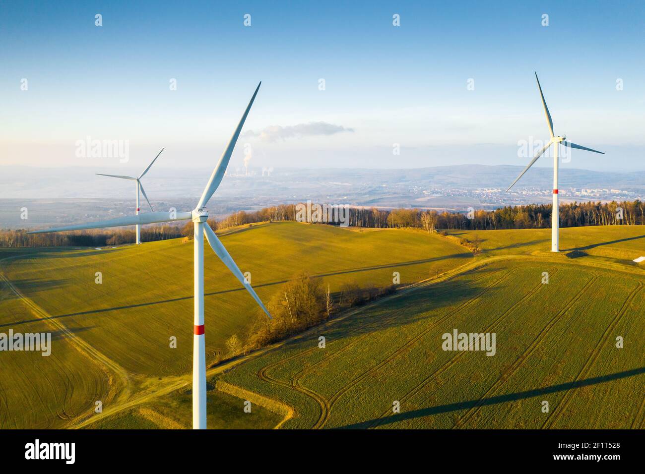 Panoramic view of wind farm or wind park, with high wind turbines for ...