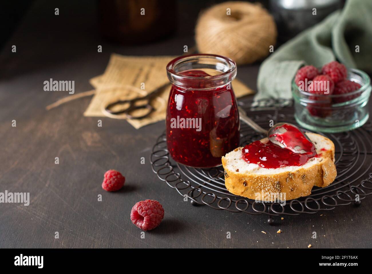 Raspberry jam in glass jar and sandwich with fresh raspberry berries on ...