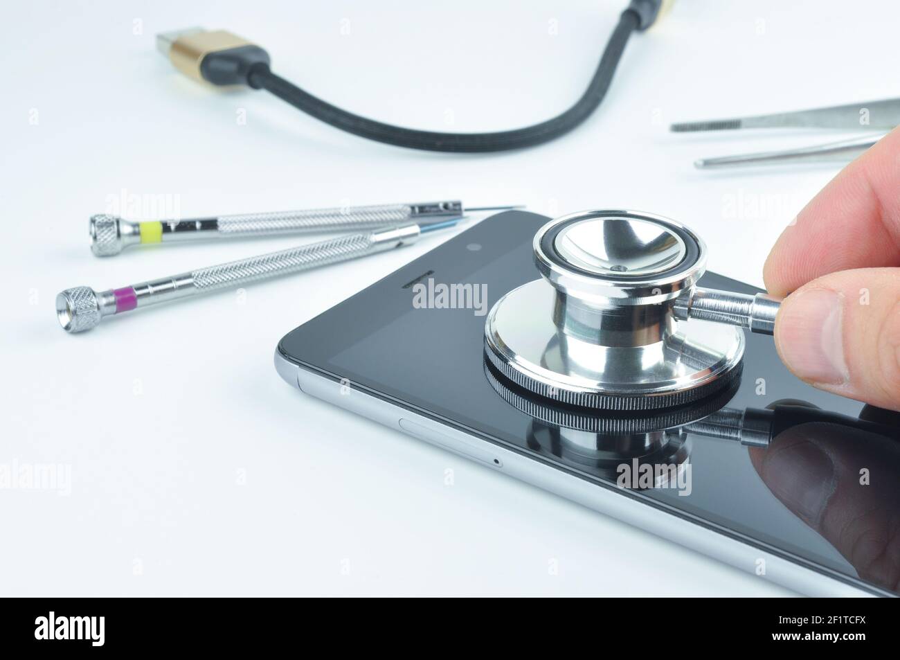 Men is using a stethoscope for phone examination with empty copy space ...