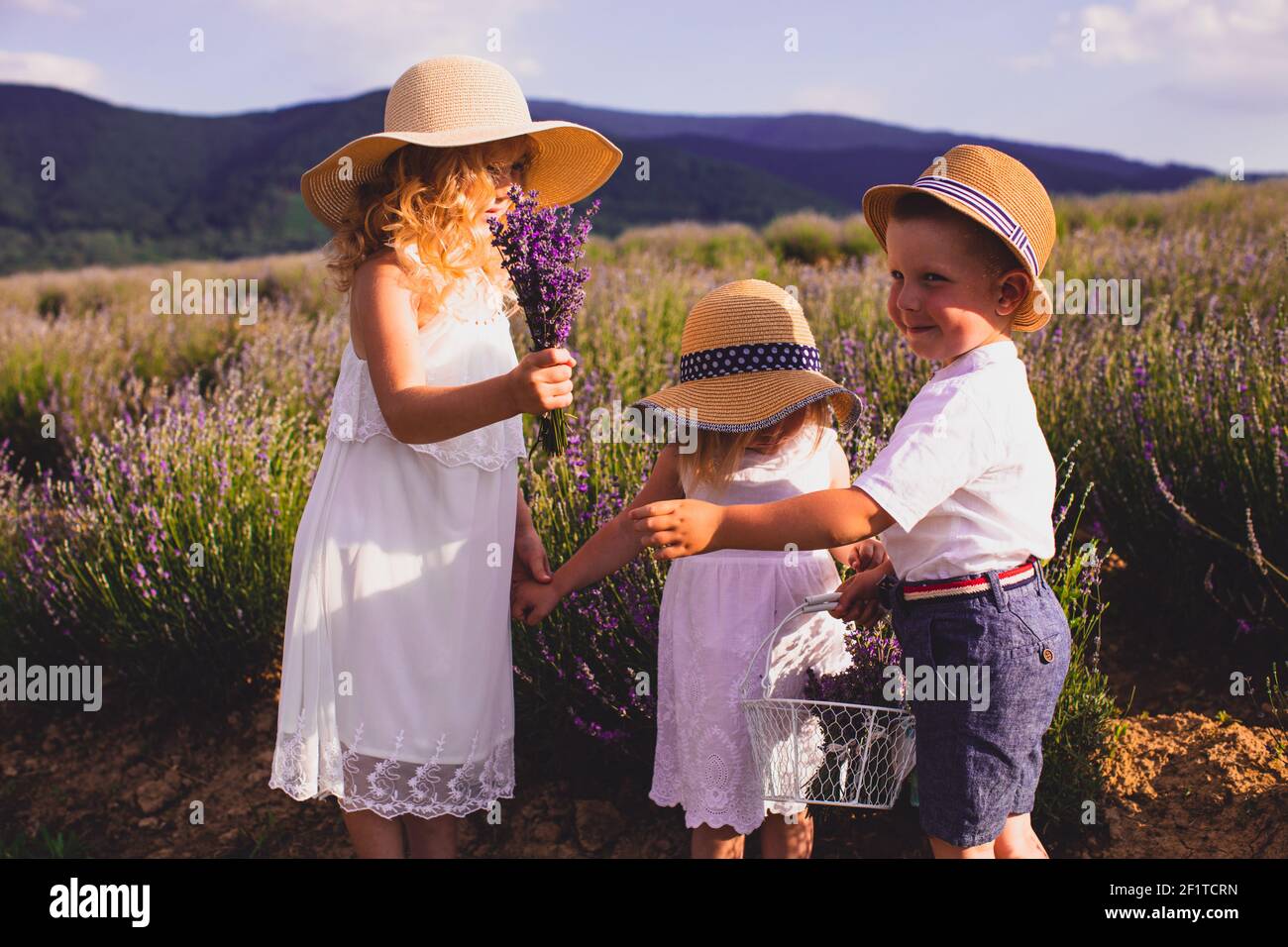 Three adorable kids, brother and two sisters Stock Photo - Alamy