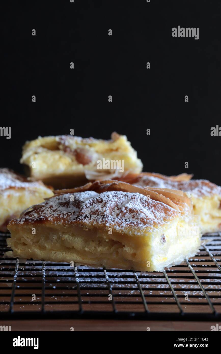 Greek cuisine. Bougatsa, homemade traditional dessert with phyllo ...