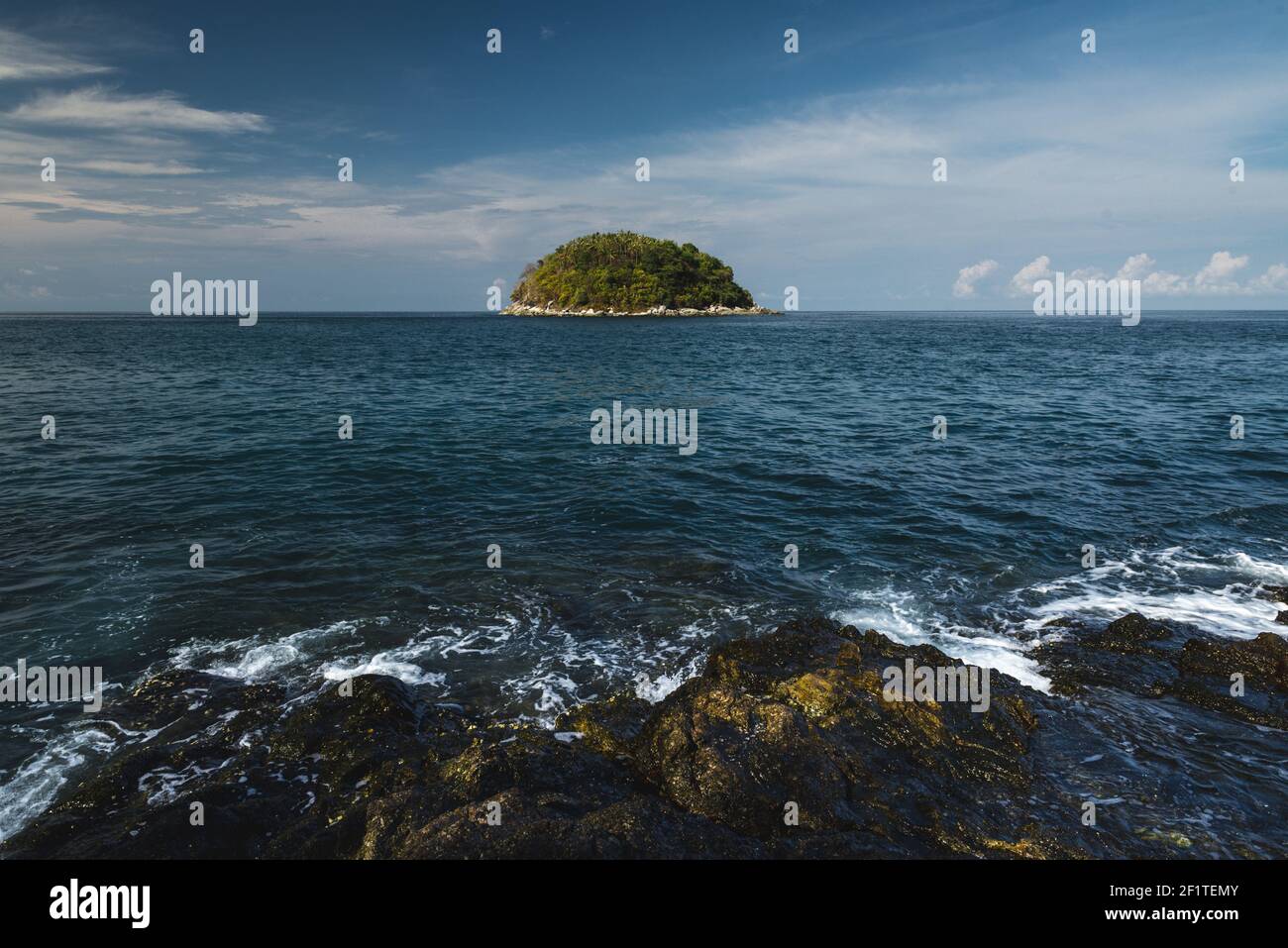 Alone little island in ocean Stock Photo - Alamy