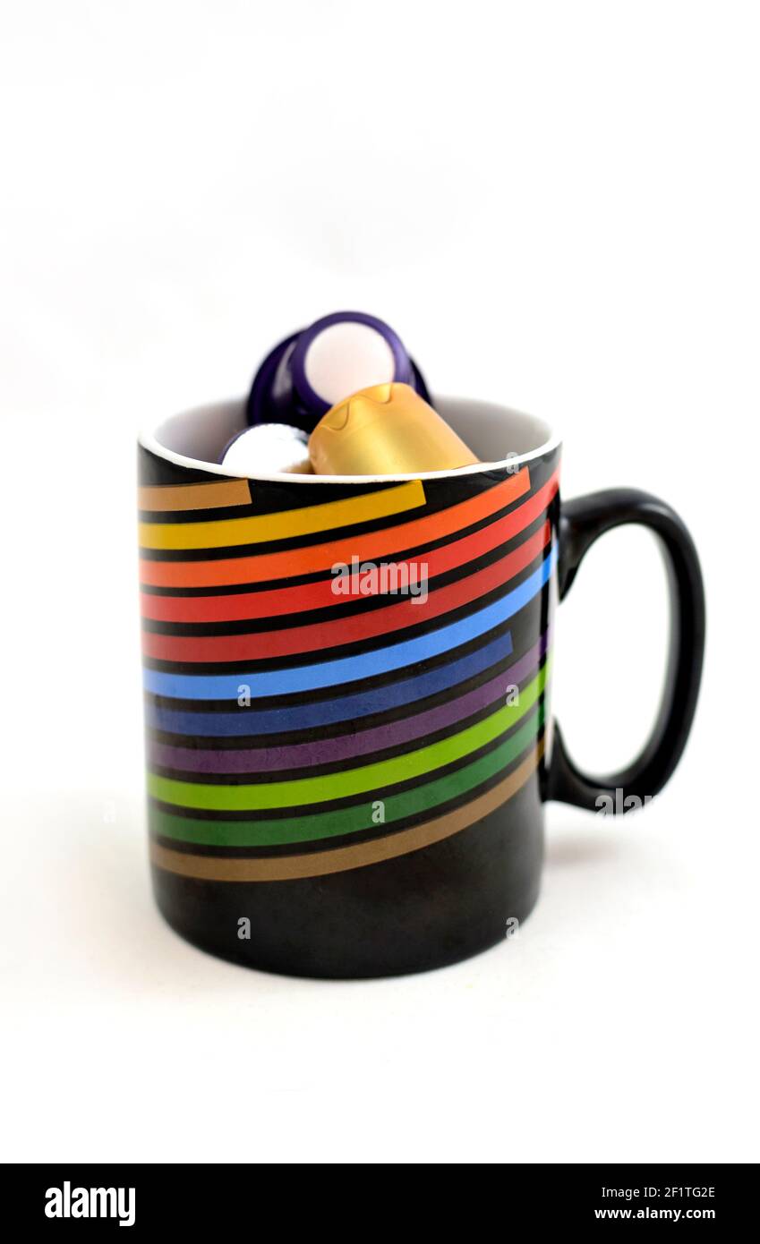 Interesting mug design and coffee pods on a white background Stock ...