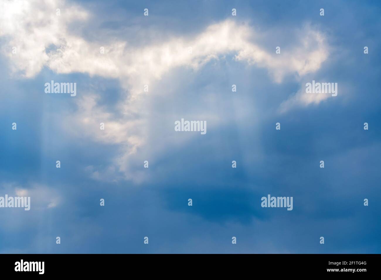 Sun rays falling from the heavenly sky Stock Photo - Alamy