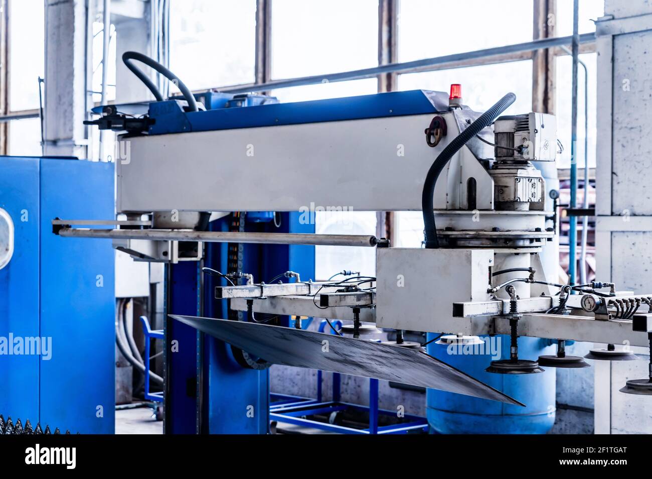Big machine for Sheet metal loading in factory close-up Stock Photo - Alamy