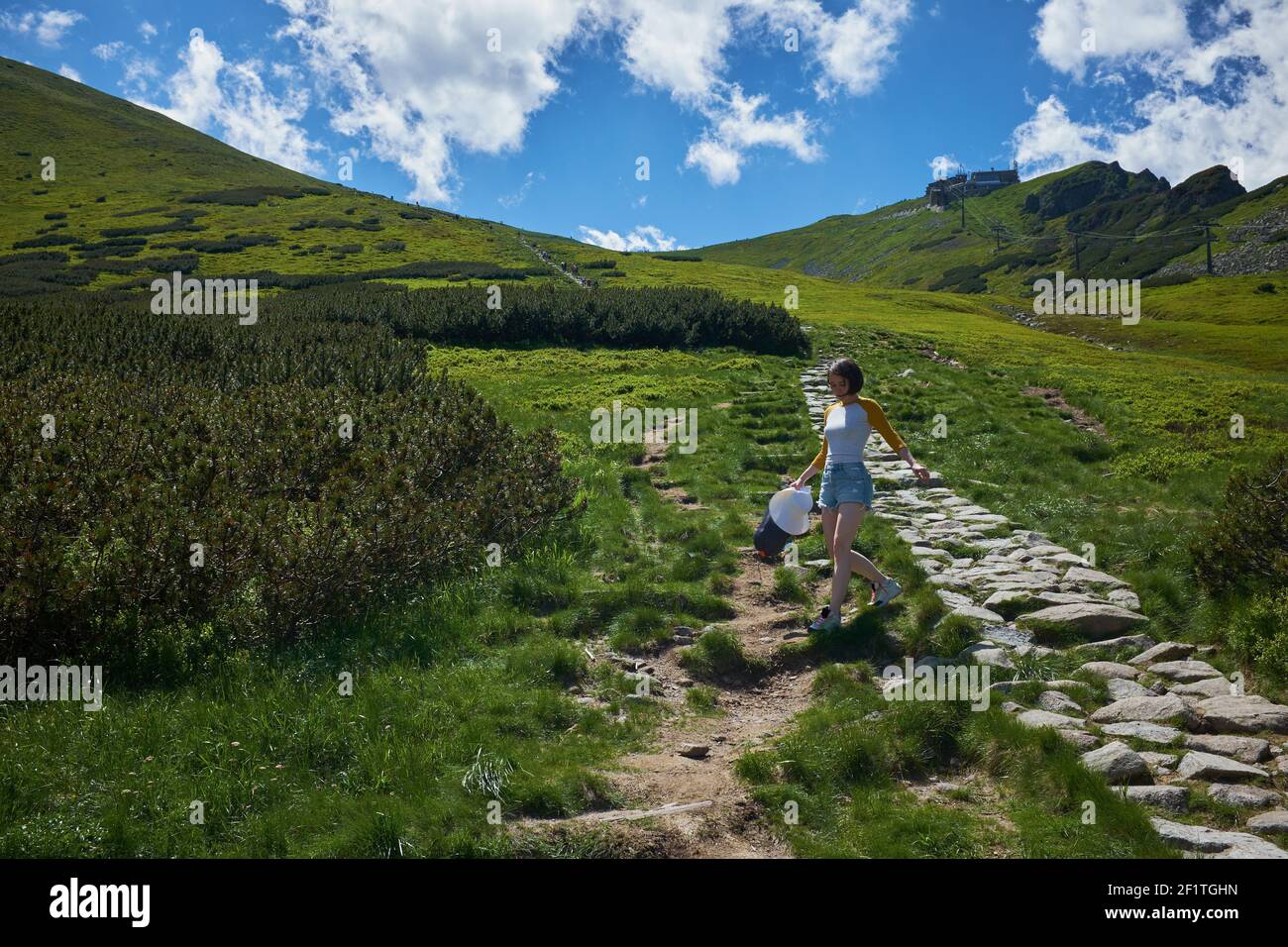 Scenic panoramic view of mountains landscape with a woman Stock Photo ...