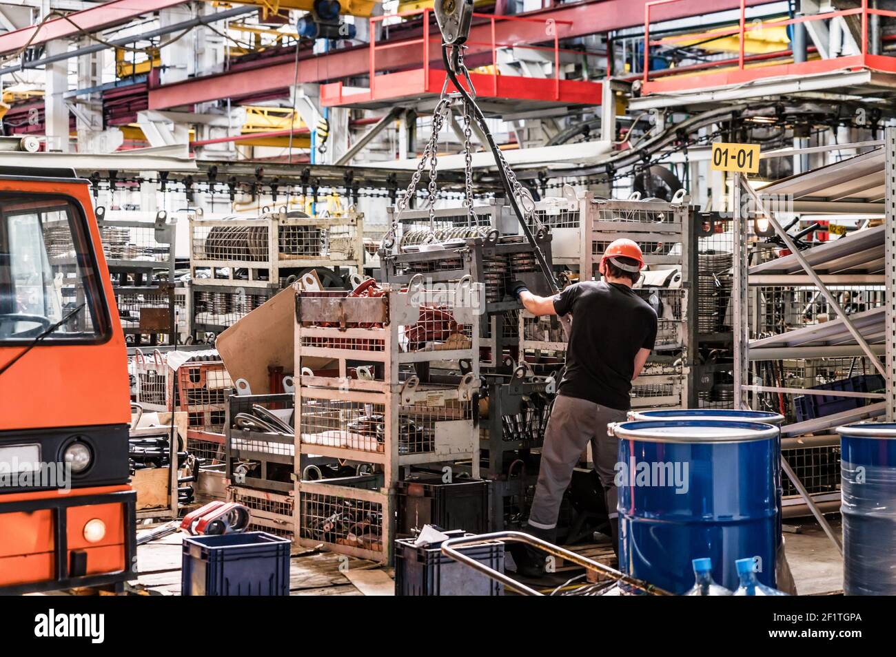 Close-up image of man at assembly room at big industrial plant ...