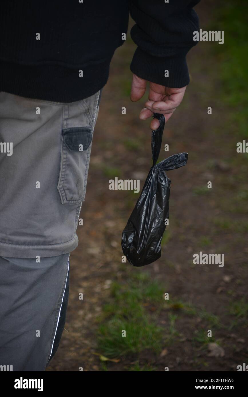 Man walking dog dog poo hi-res stock photography and images - Alamy
