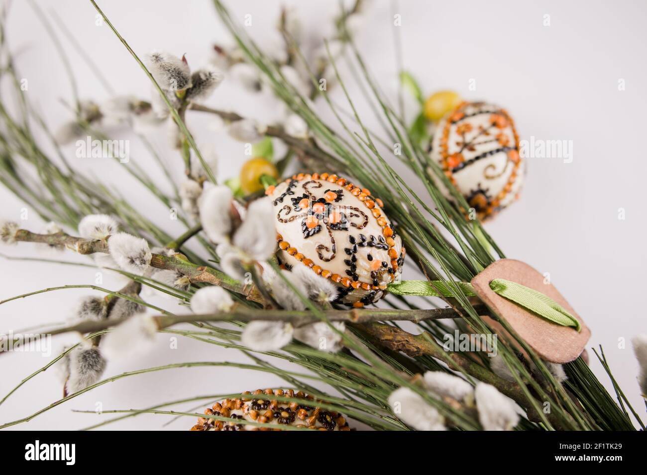 Easter eggs with a sprig on white background Stock Photo - Alamy