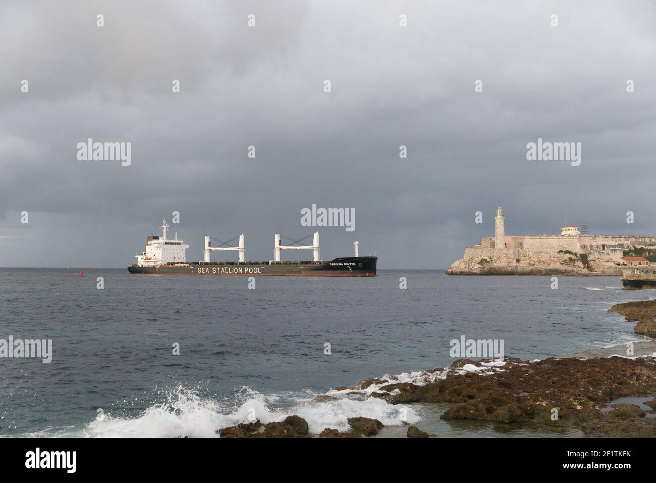Cuba, Havana - Large oil tanker passes towards the Harbor Channel as ...