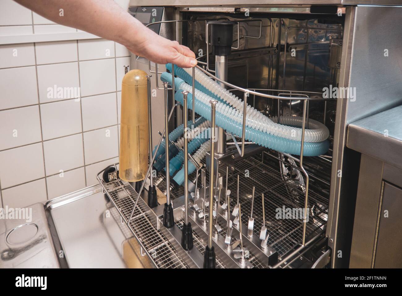 in a sterilization department of a hospital, anesthesia tubes are ...