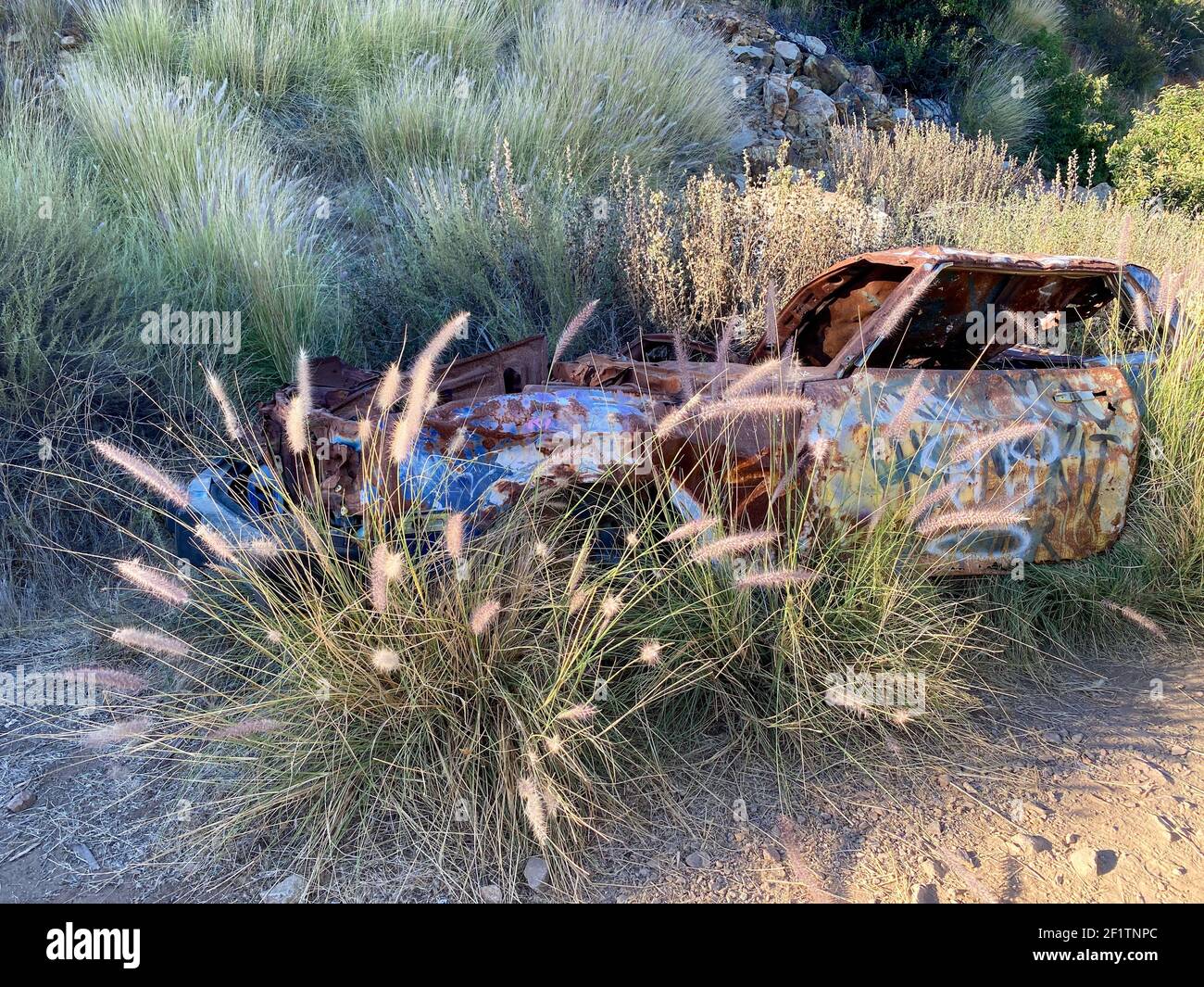 Rustic abandoned car in the mountain against blue sky Stock Photo - Alamy