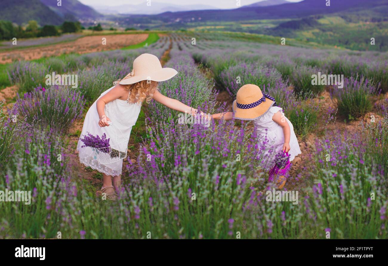 Two cute sisters travel through beautiful nature Stock Photo - Alamy