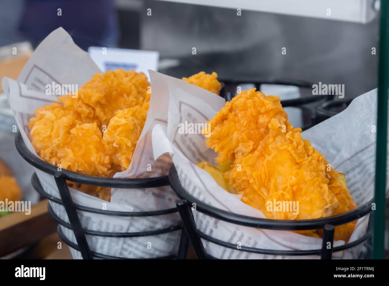 Fish wrapped in newspaper hi-res stock photography and images - Alamy